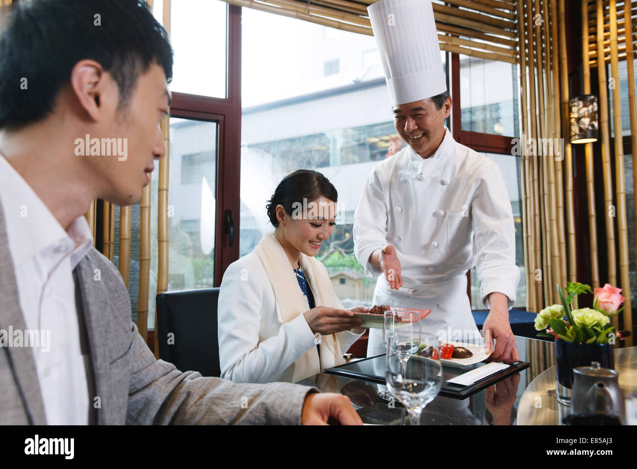 Chef with customer Stock Photo - Alamy