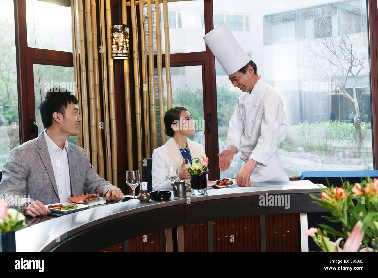 Chef with customer Stock Photo - Alamy