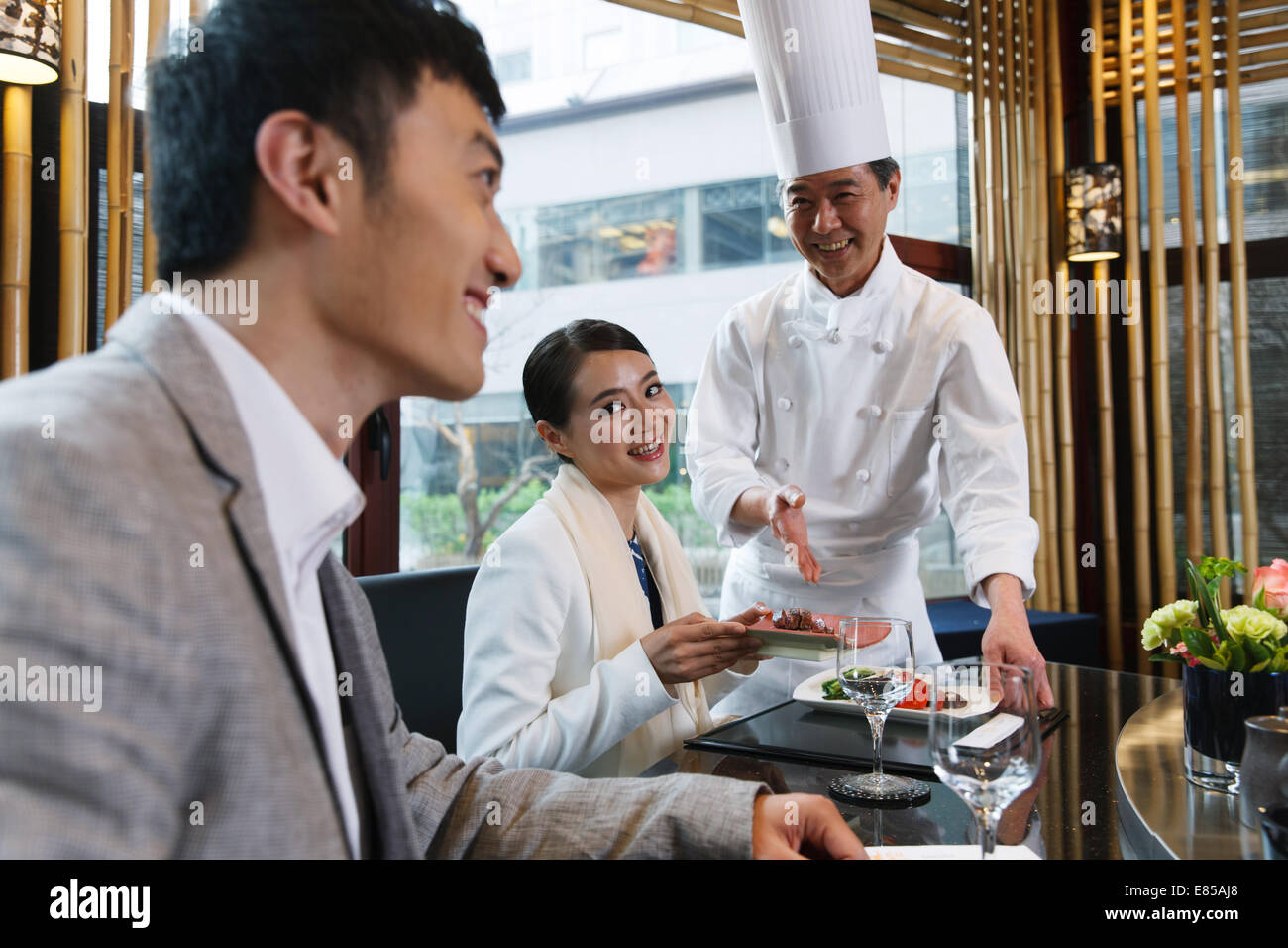 Chef with customer Stock Photo - Alamy
