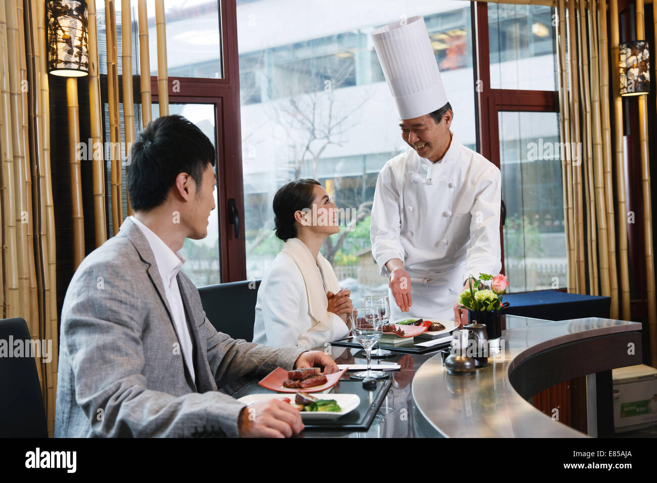 Chef with customer Stock Photo - Alamy
