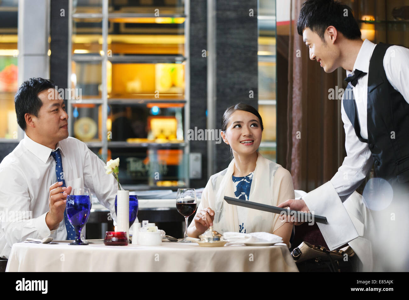 Restaurant service staff Stock Photo - Alamy