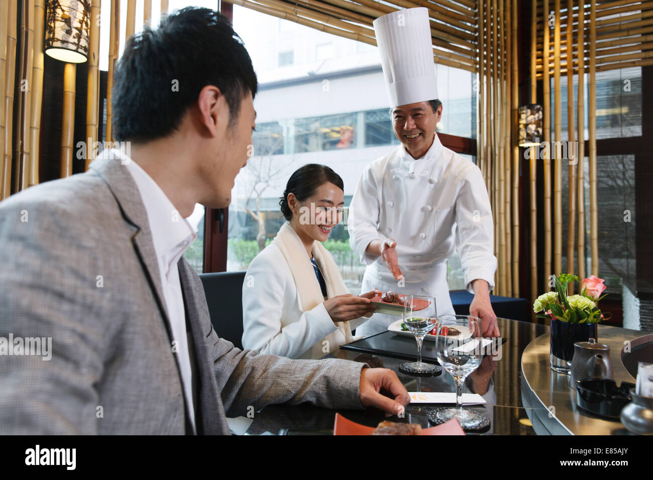 Chef with customer Stock Photo - Alamy