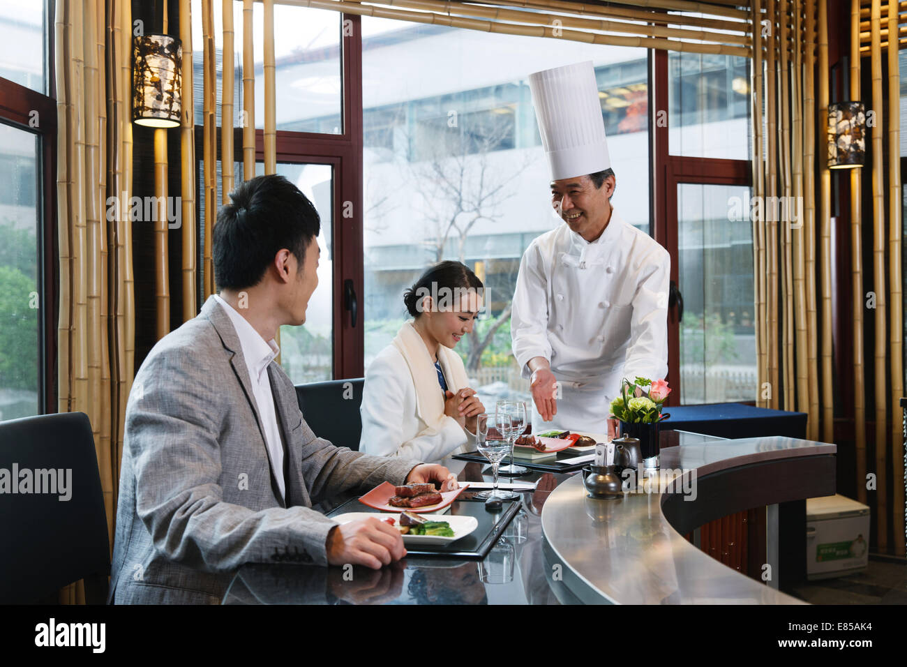 Chef with customer Stock Photo - Alamy