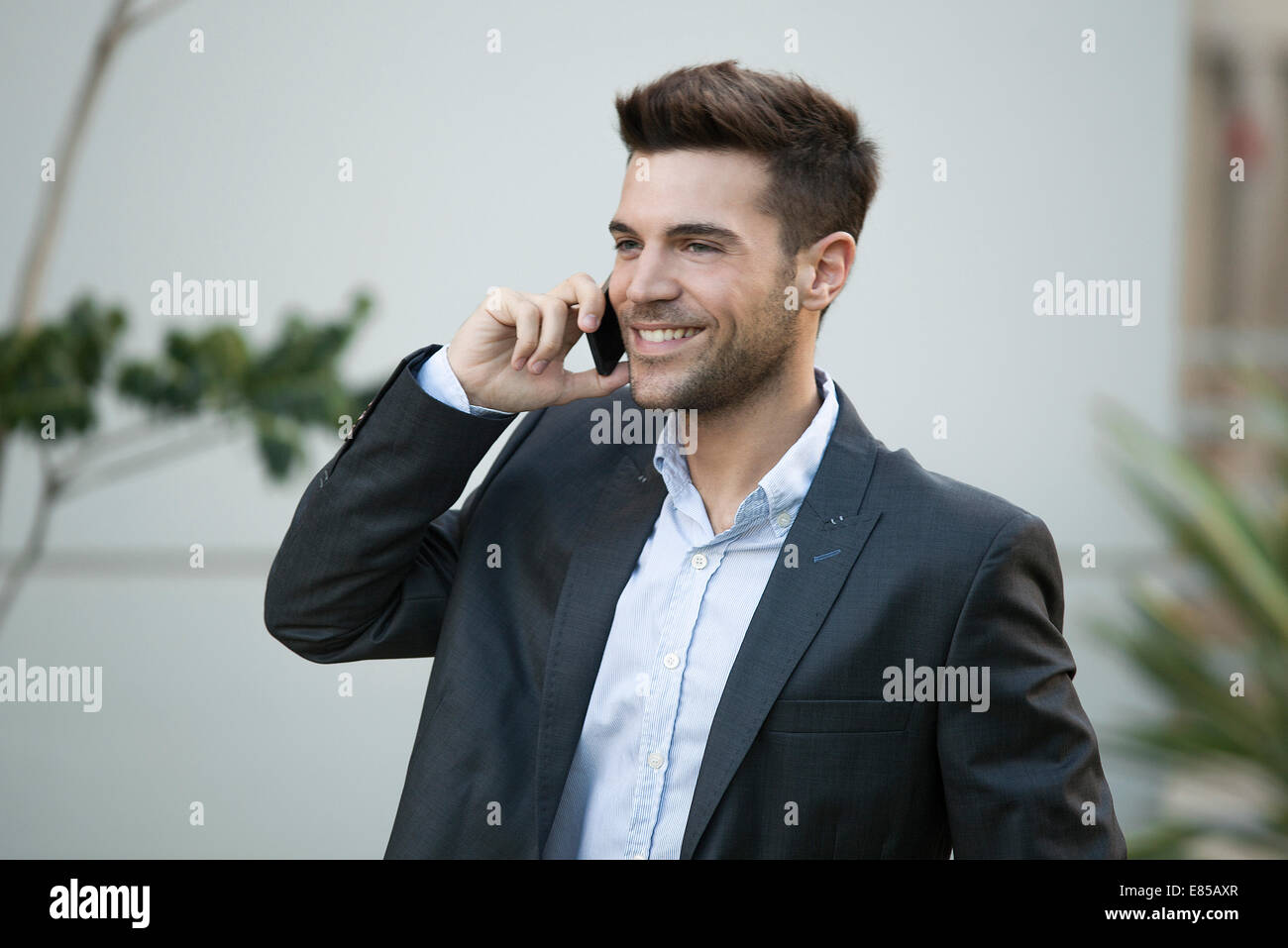 Businessman using cell phone outdoors Stock Photo - Alamy Businessman using cell phone outdoors Stock Photo - Alamy