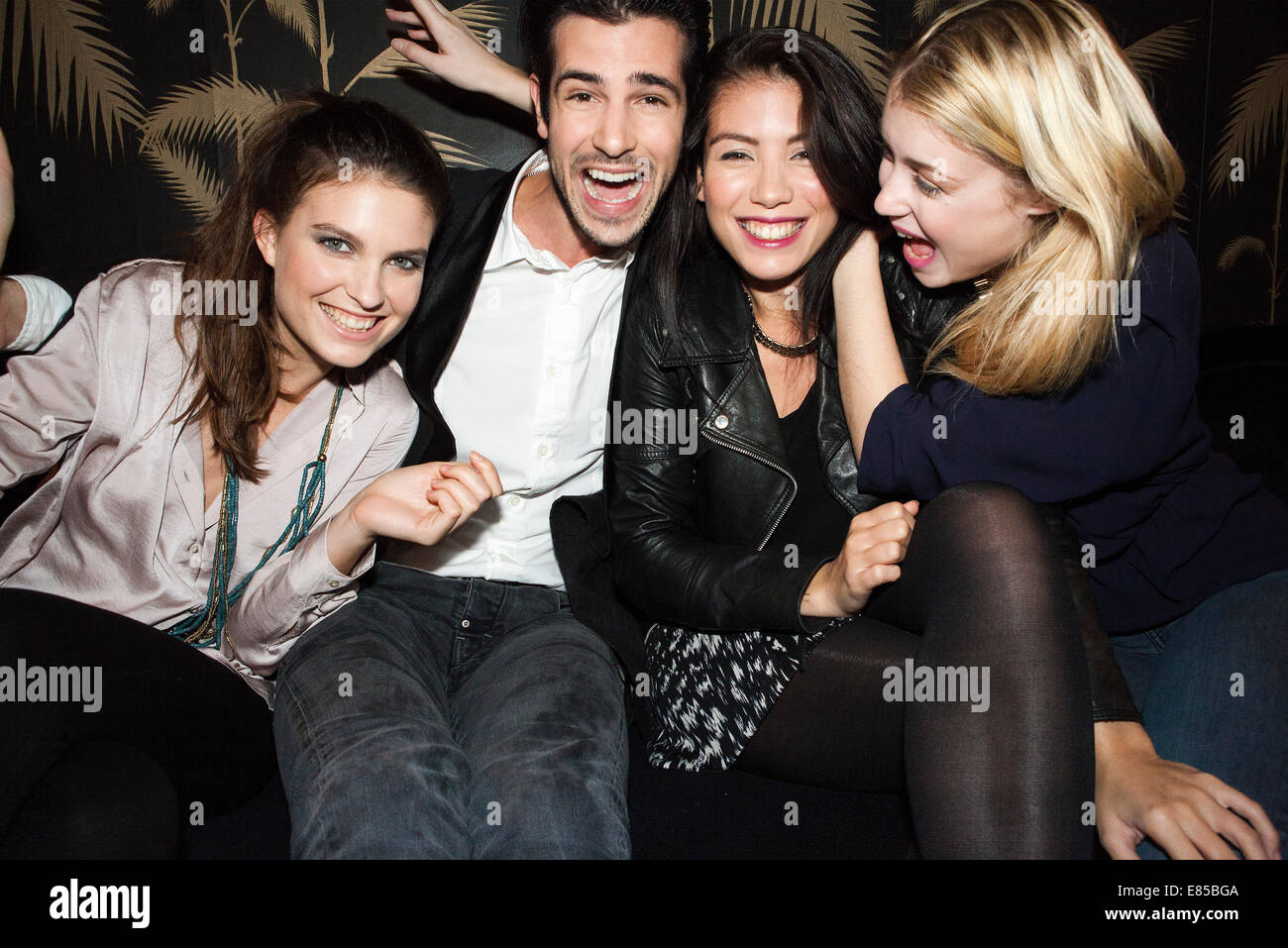 Friends celebrating holiday at night club Stock Photo - Alamy