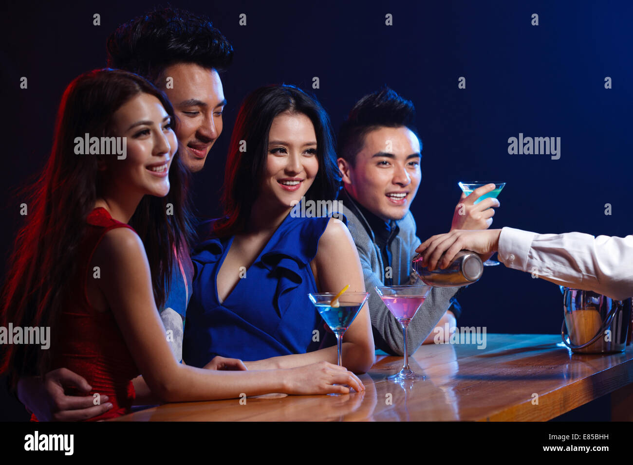 Young people at bar Stock Photo - Alamy