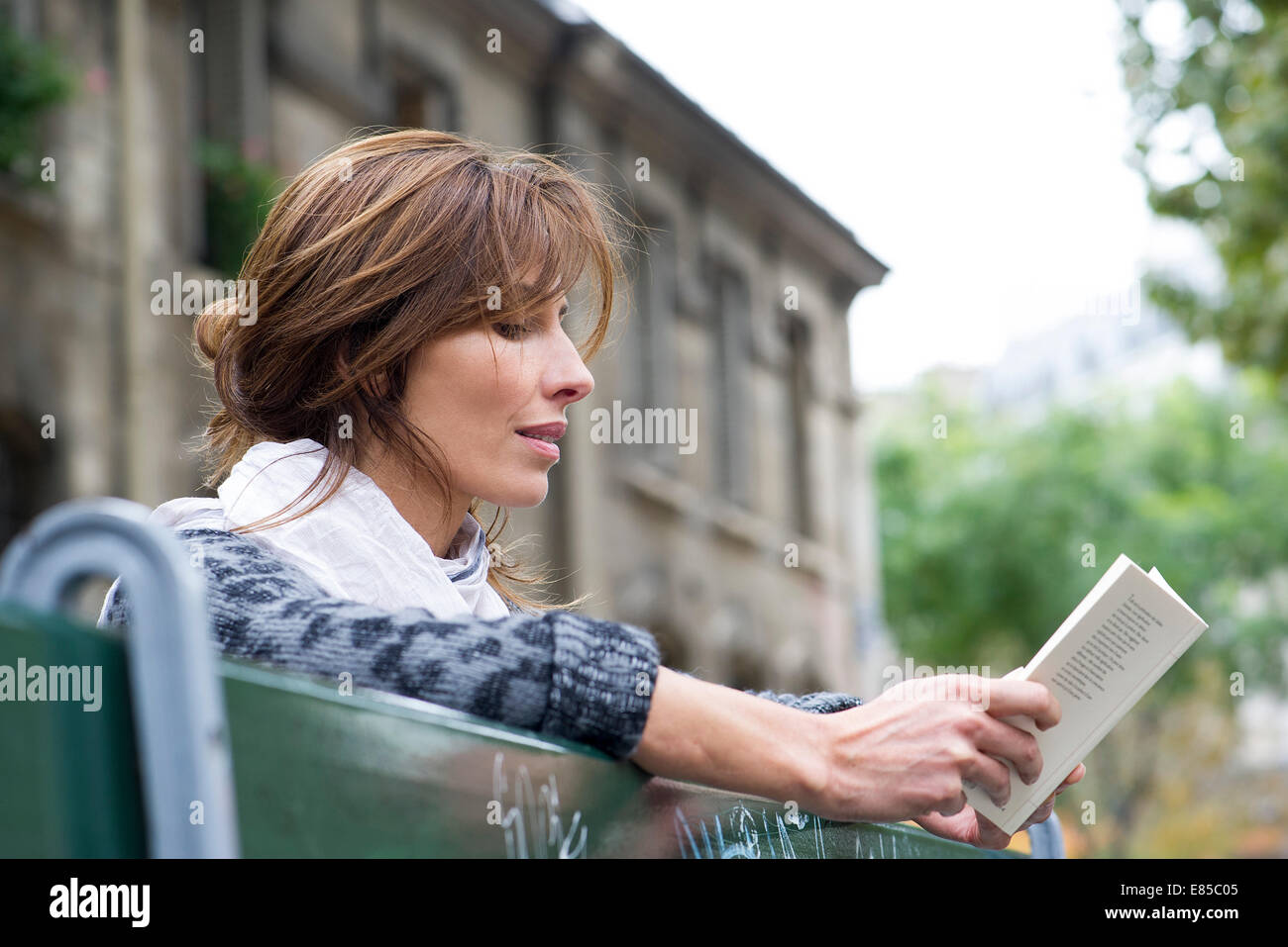 Tourist using guidebook Stock Photo - Alamy