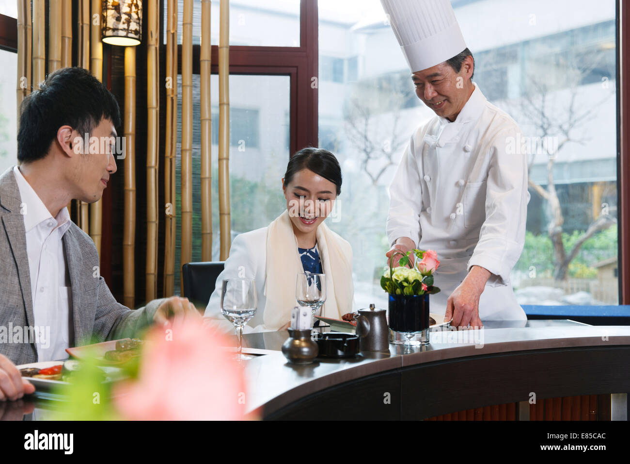 Chef with customer Stock Photo - Alamy
