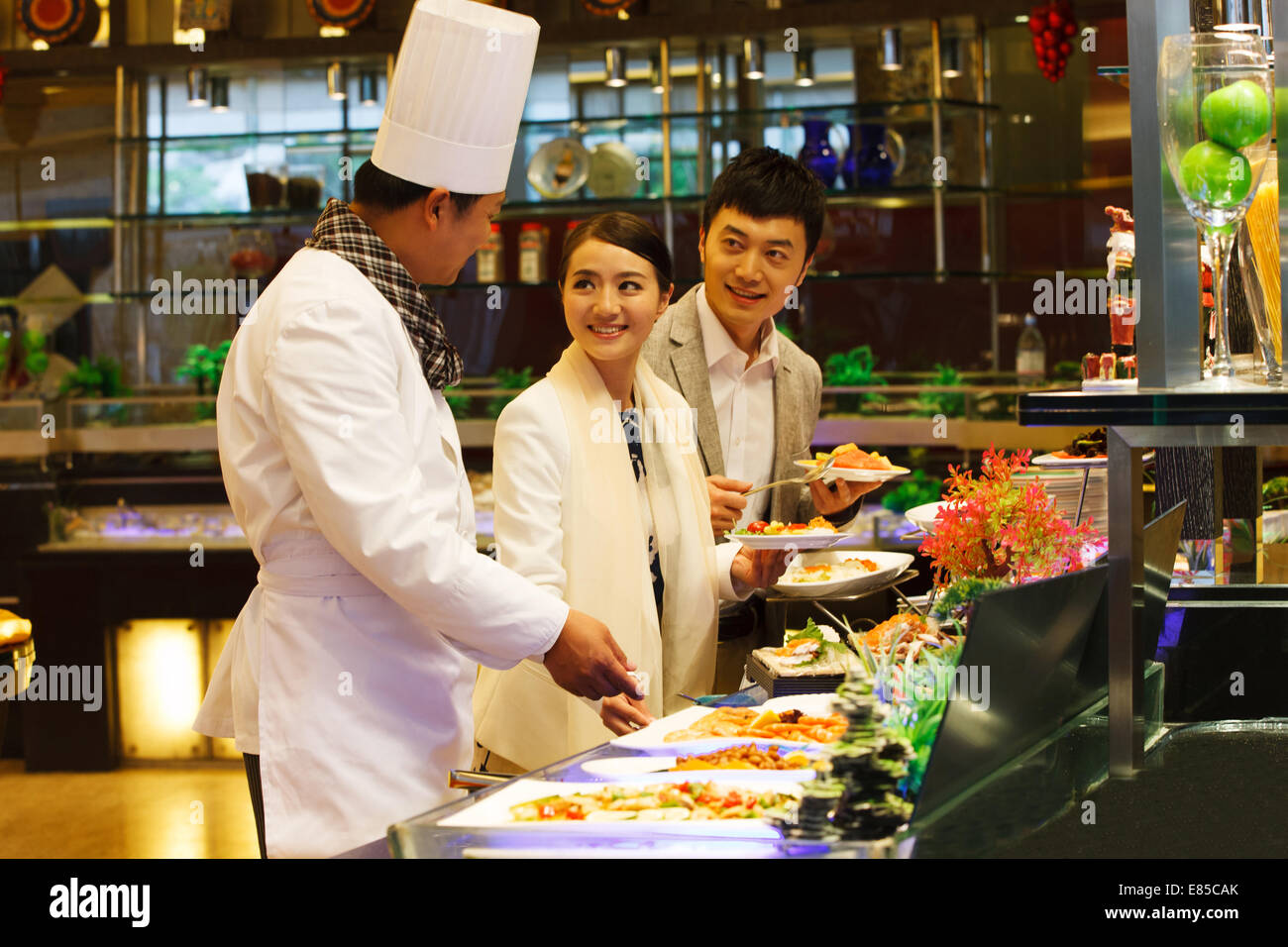 Chef with customer Stock Photo - Alamy