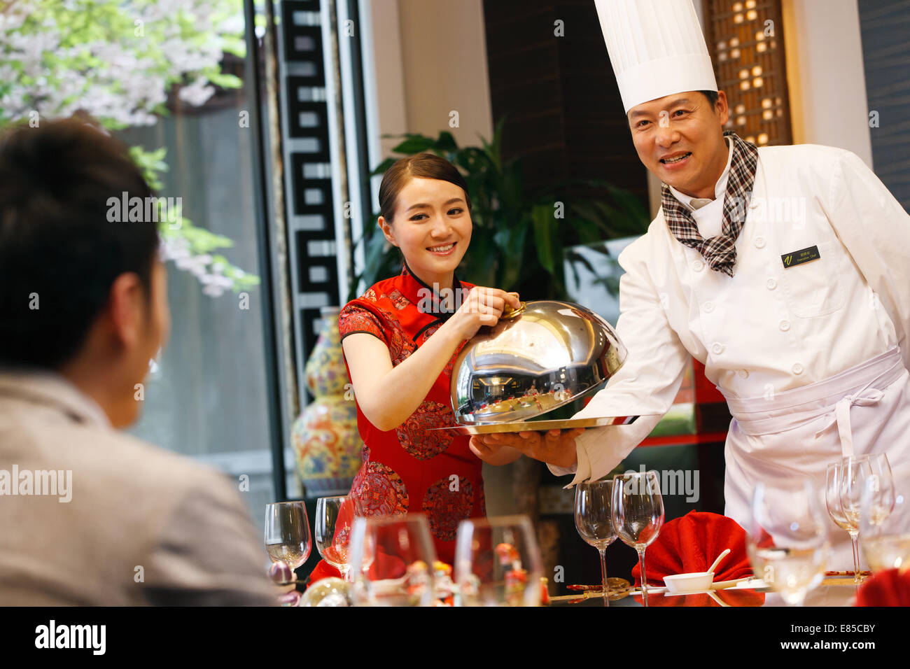 Chef with customer Stock Photo - Alamy
