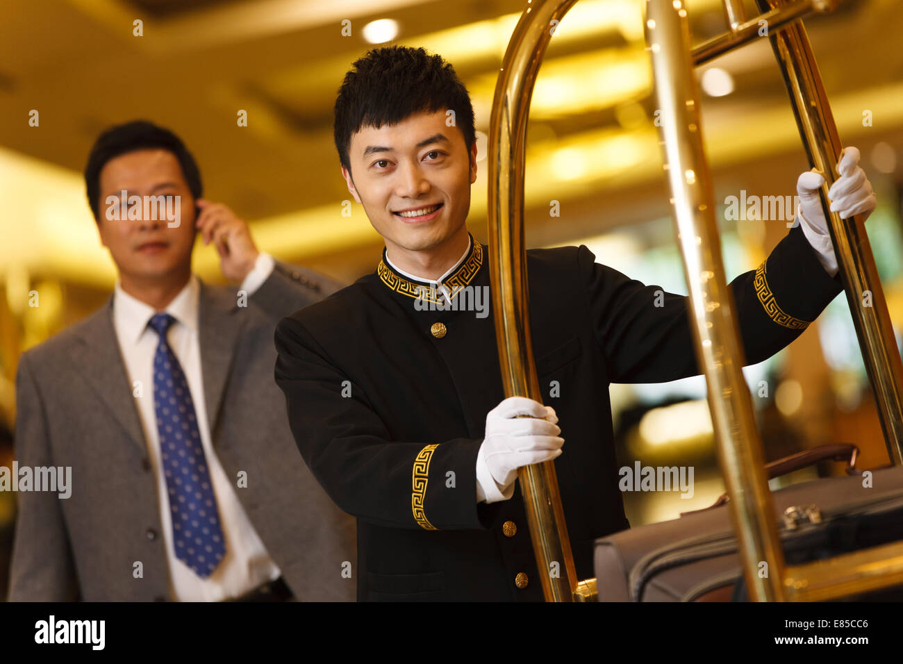 Portrait of hotel service staff Stock Photo - Alamy