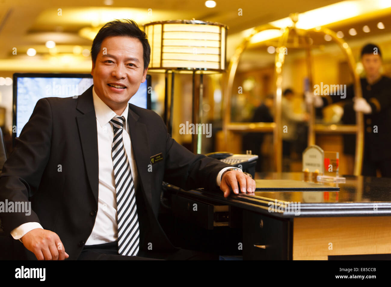 Portrait of hotel service staff Stock Photo - Alamy