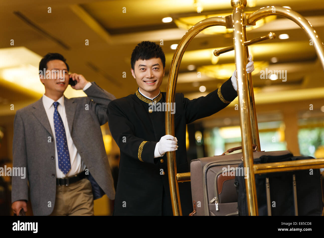 Portrait of hotel service staff Stock Photo - Alamy