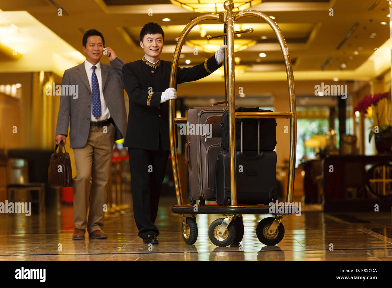 Portrait of hotel service staff Stock Photo - Alamy