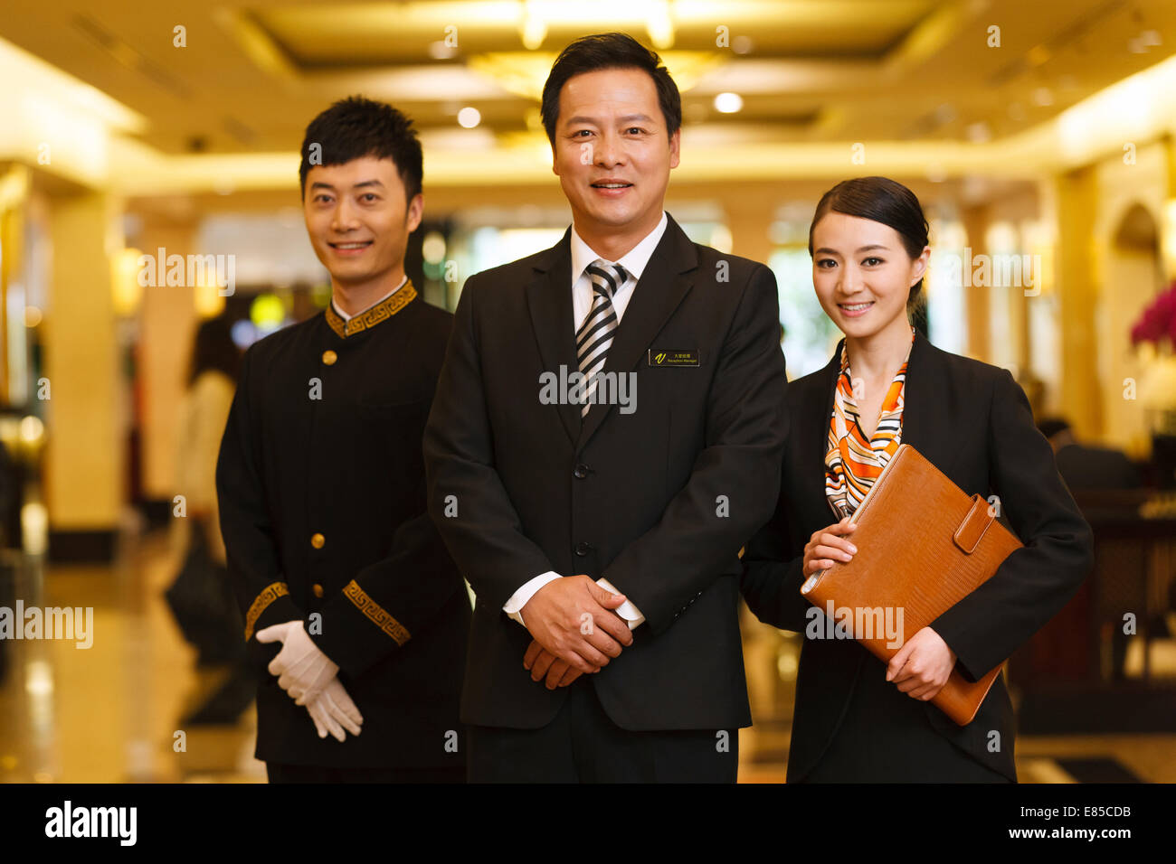 Portrait of hotel service staff Stock Photo - Alamy