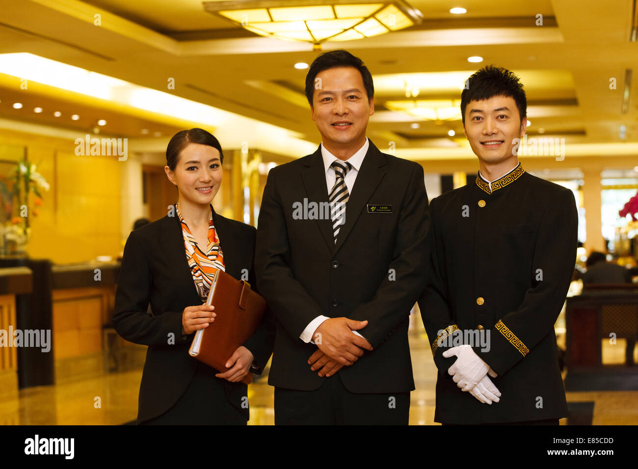 Portrait of hotel service staff Stock Photo - Alamy