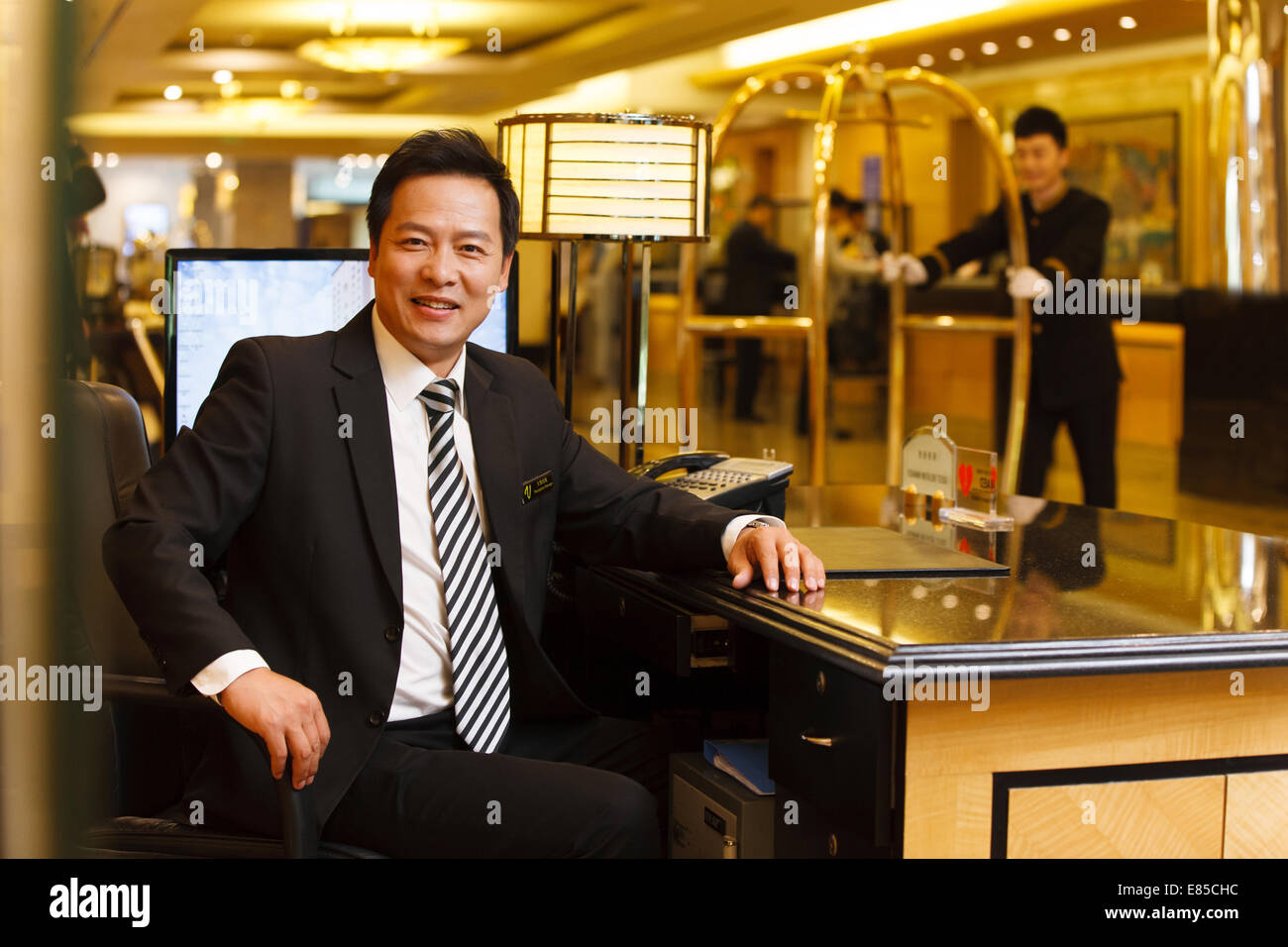 Portrait of hotel service staff Stock Photo - Alamy