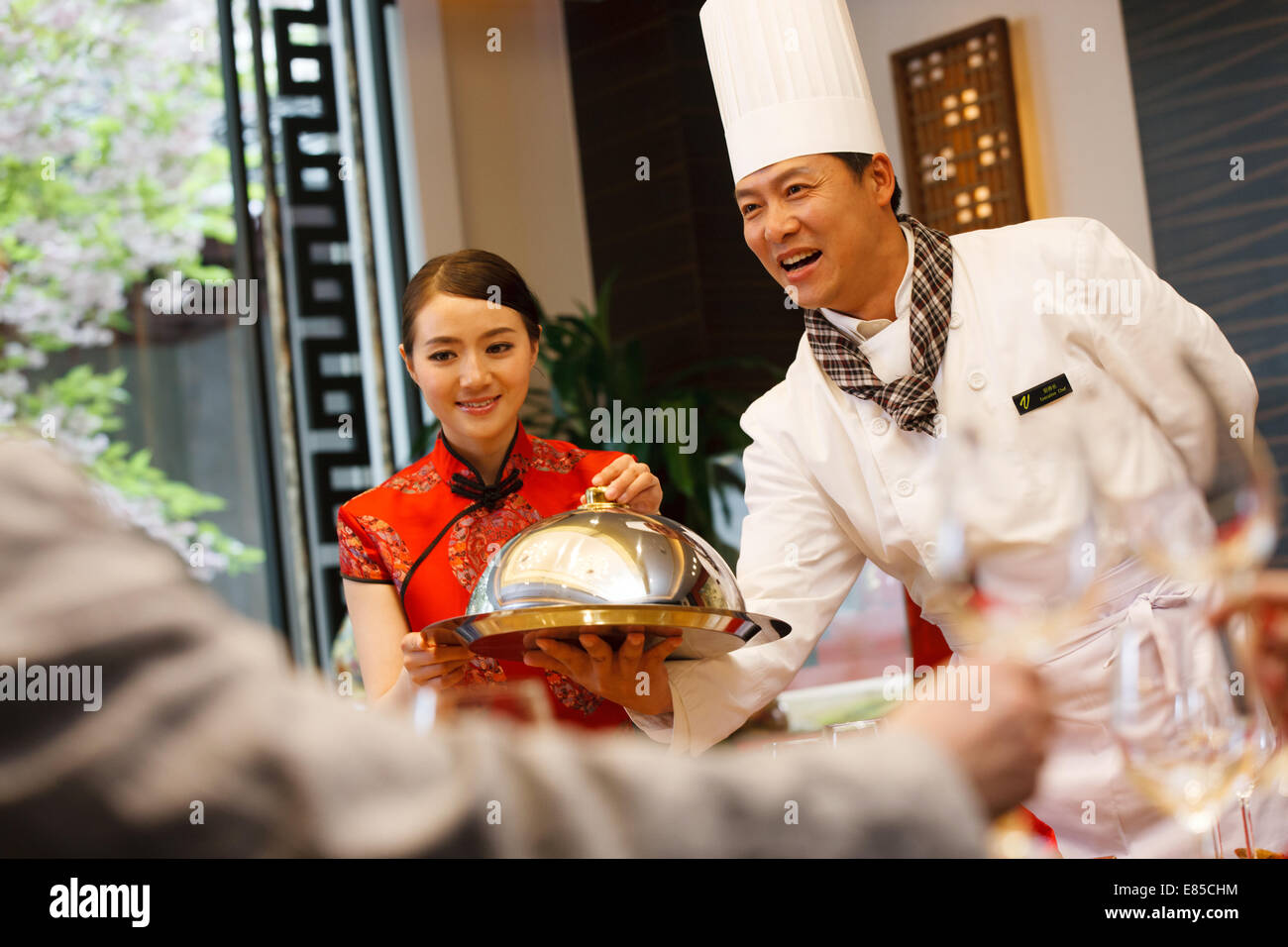 Chef with customer Stock Photo - Alamy