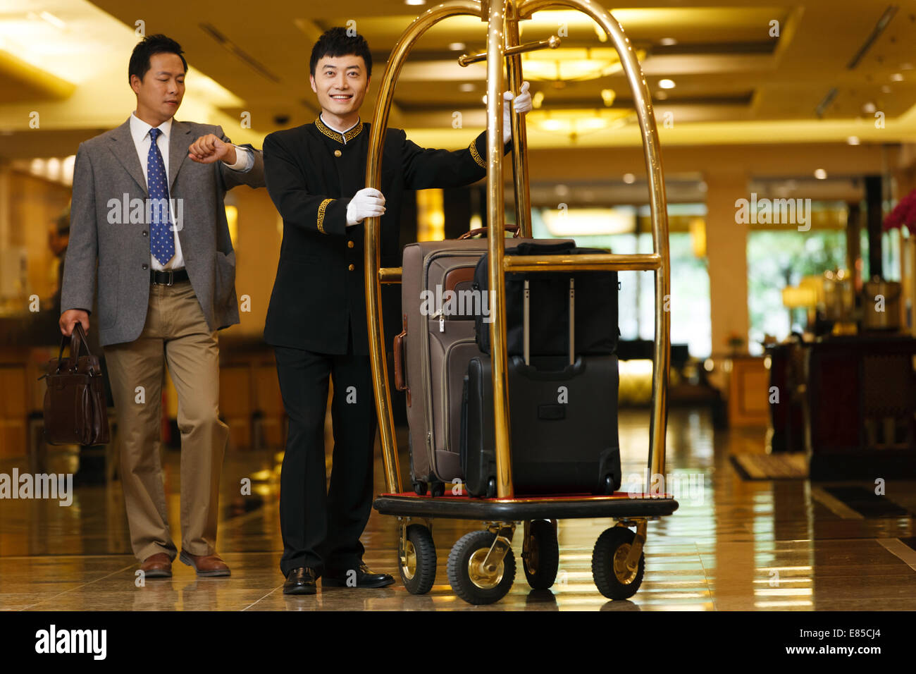 Portrait of hotel service staff Stock Photo - Alamy
