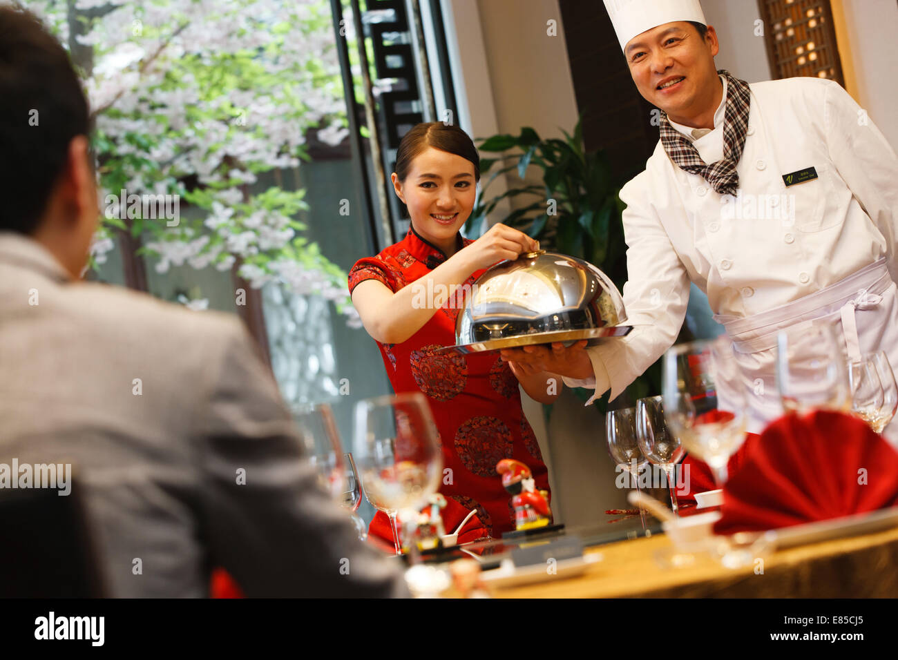 Chef with customer Stock Photo - Alamy