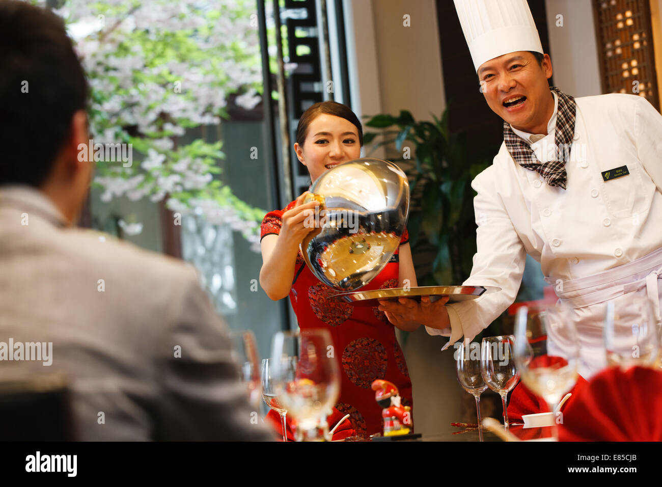 Chef with customer Stock Photo - Alamy