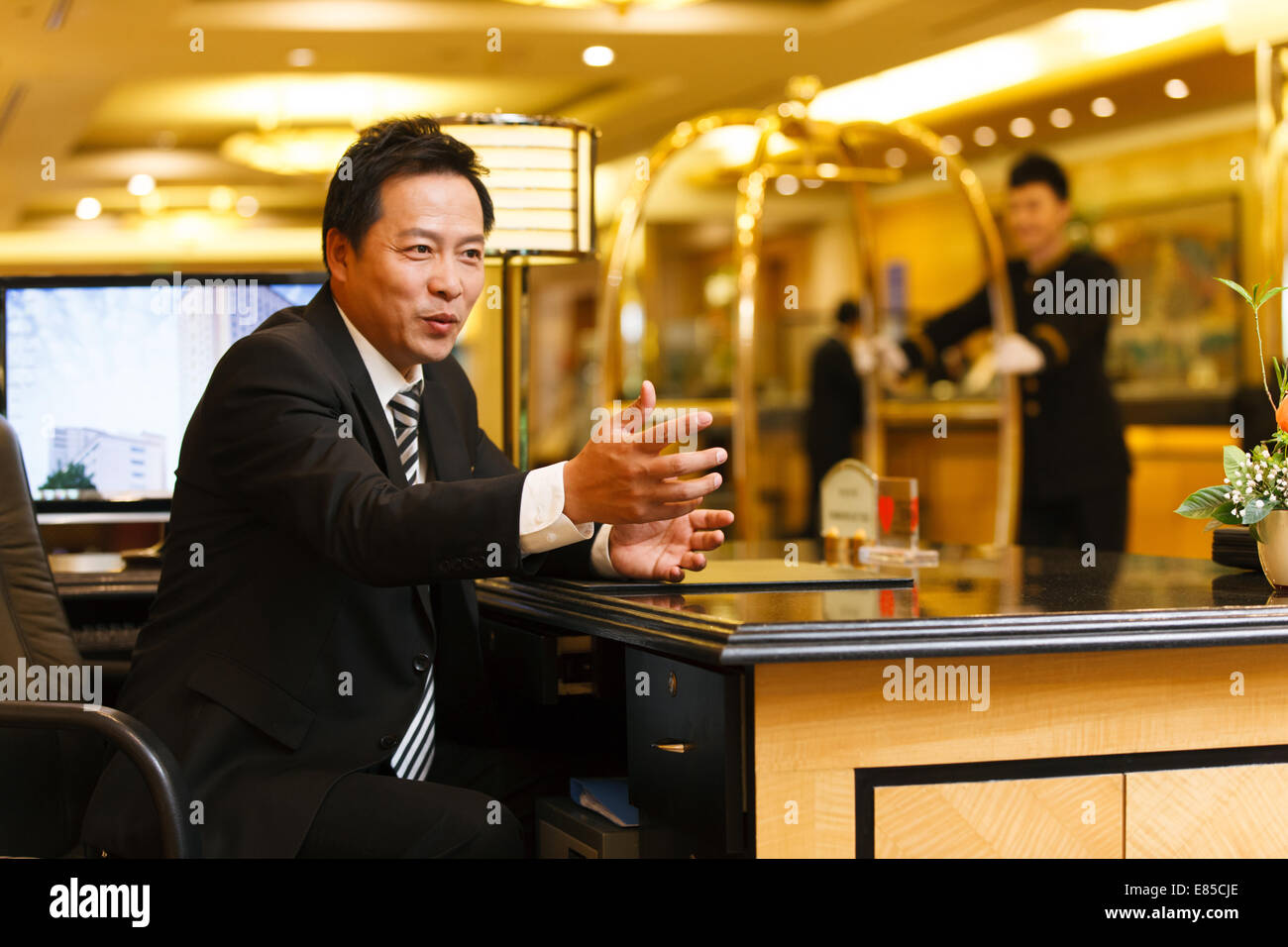 Portrait of hotel service staff Stock Photo - Alamy