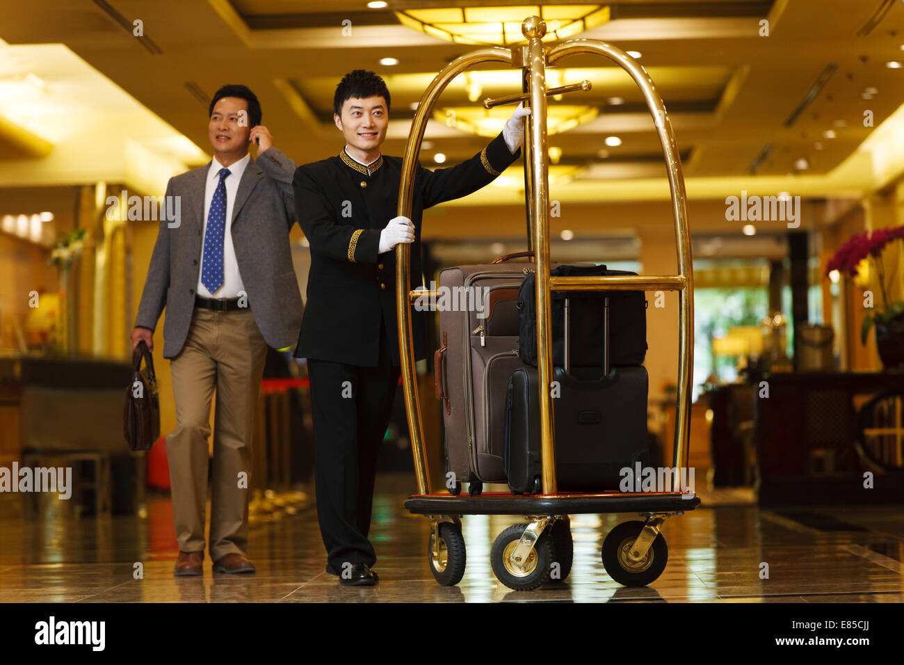 Portrait of hotel service staff Stock Photo - Alamy