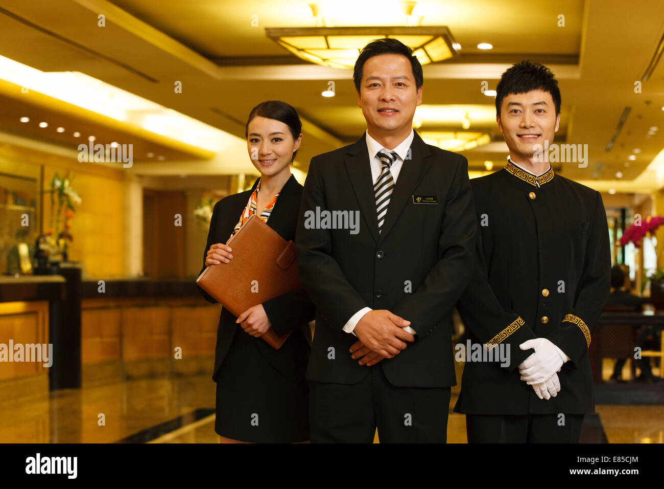 Portrait of hotel service staff Stock Photo - Alamy