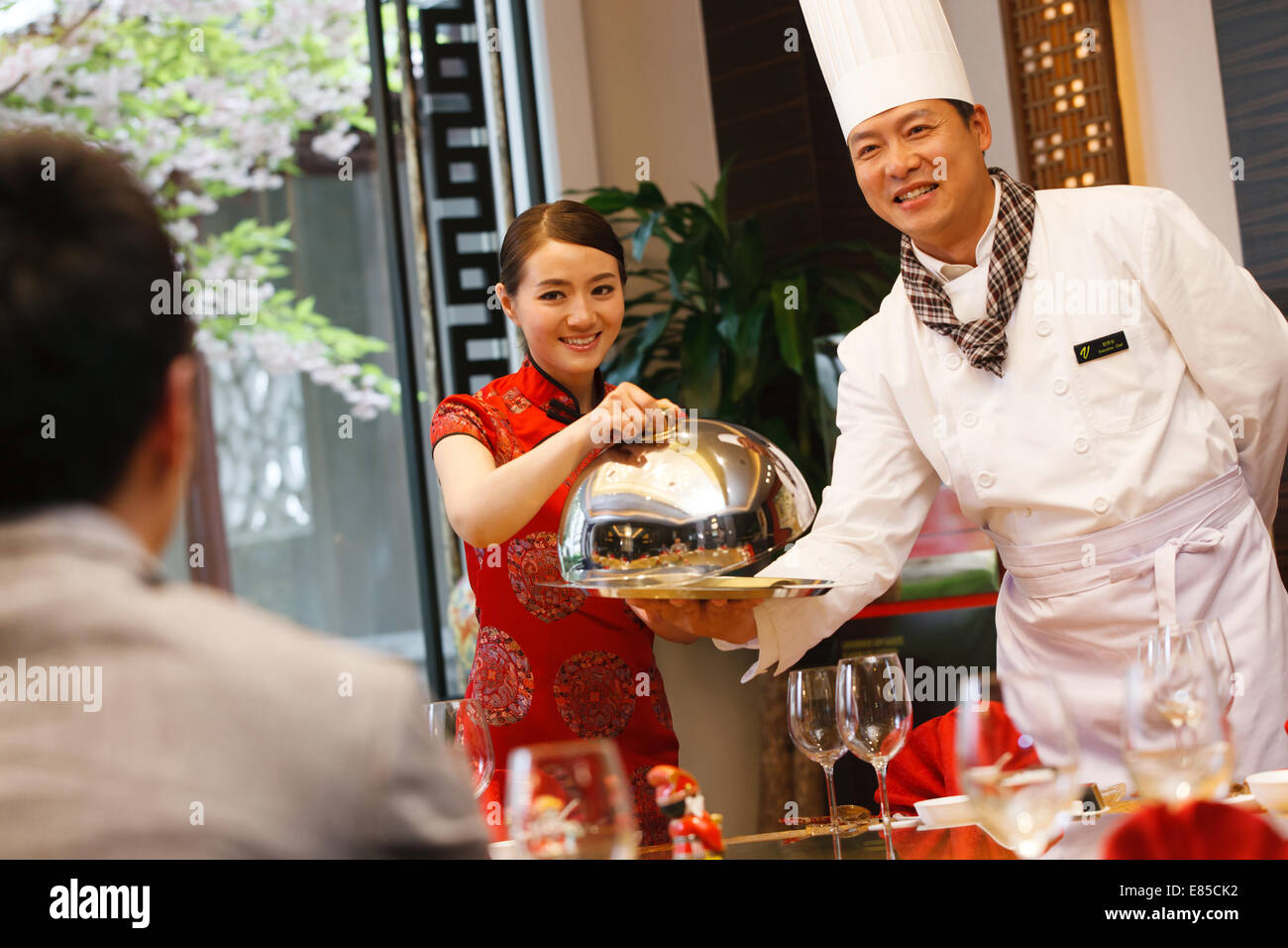 Chef with customer Stock Photo - Alamy