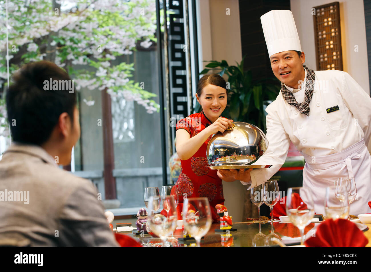 Chef with customer Stock Photo - Alamy