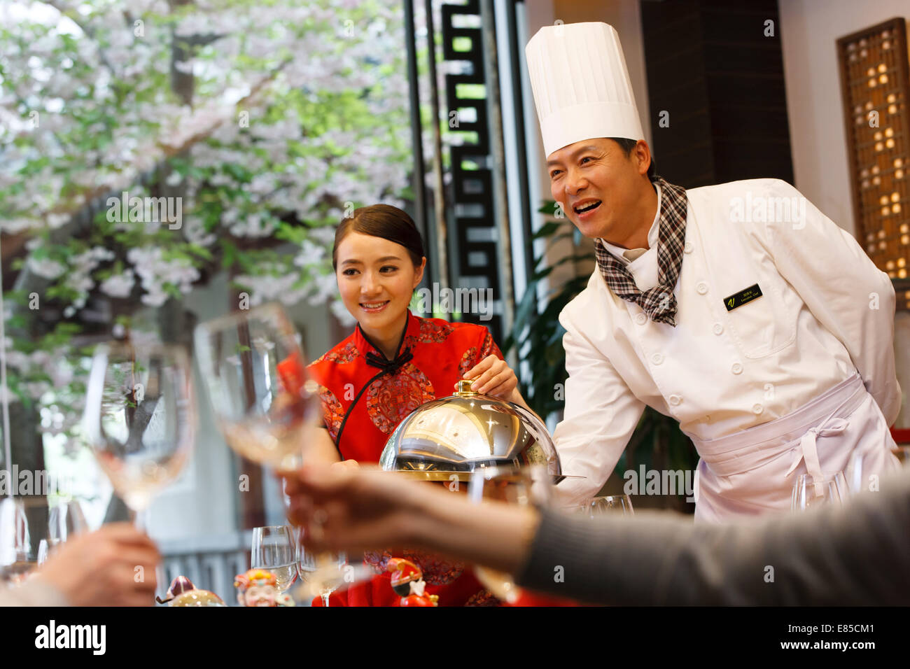 Chef with customer Stock Photo - Alamy