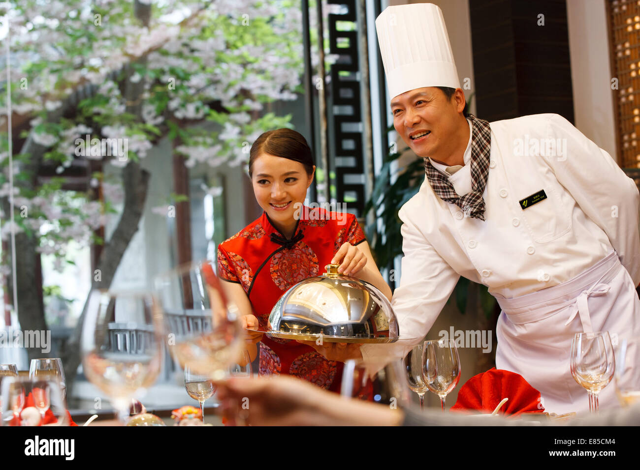 Chef with customer Stock Photo - Alamy
