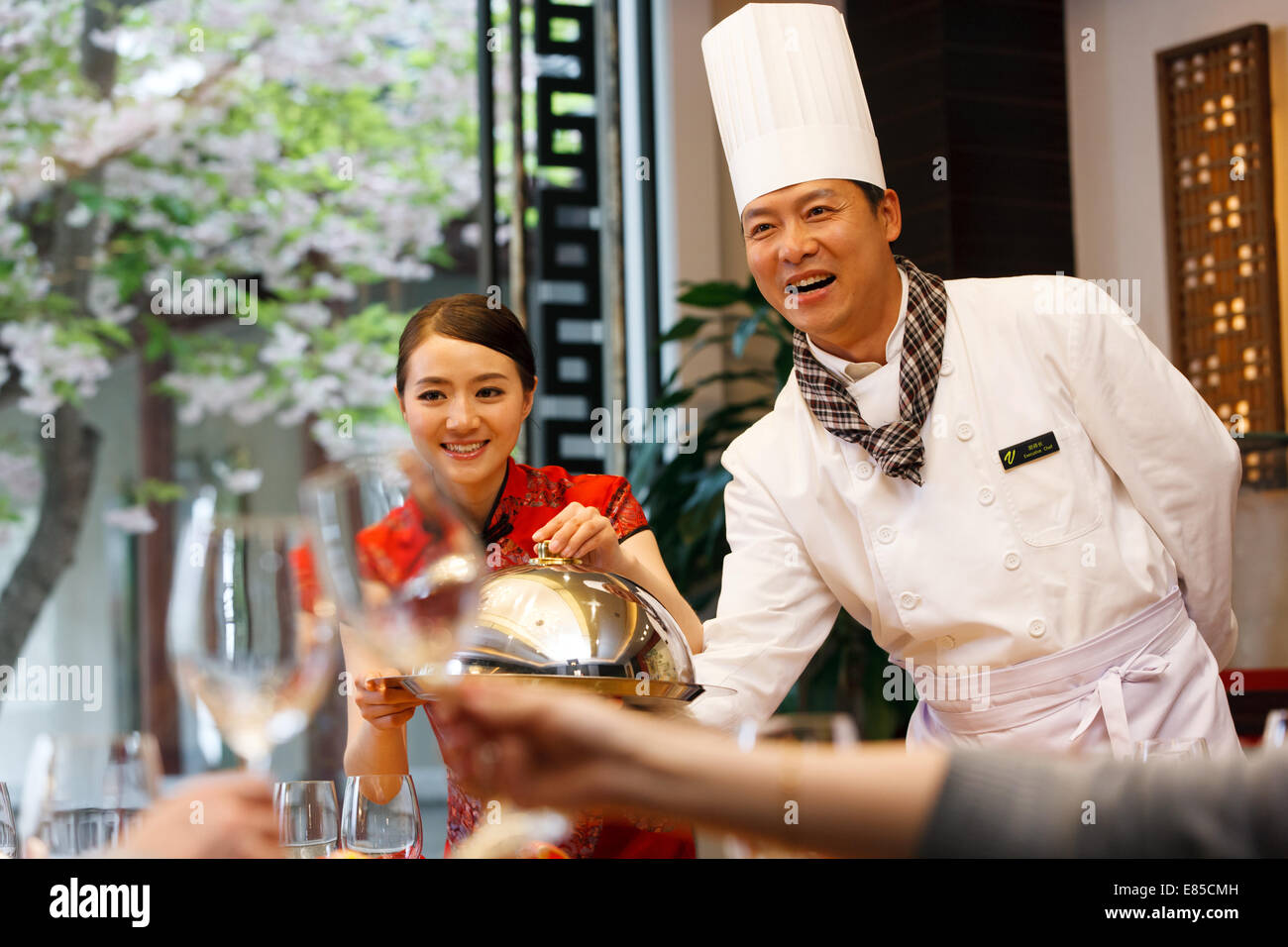 Chef with customer Stock Photo - Alamy