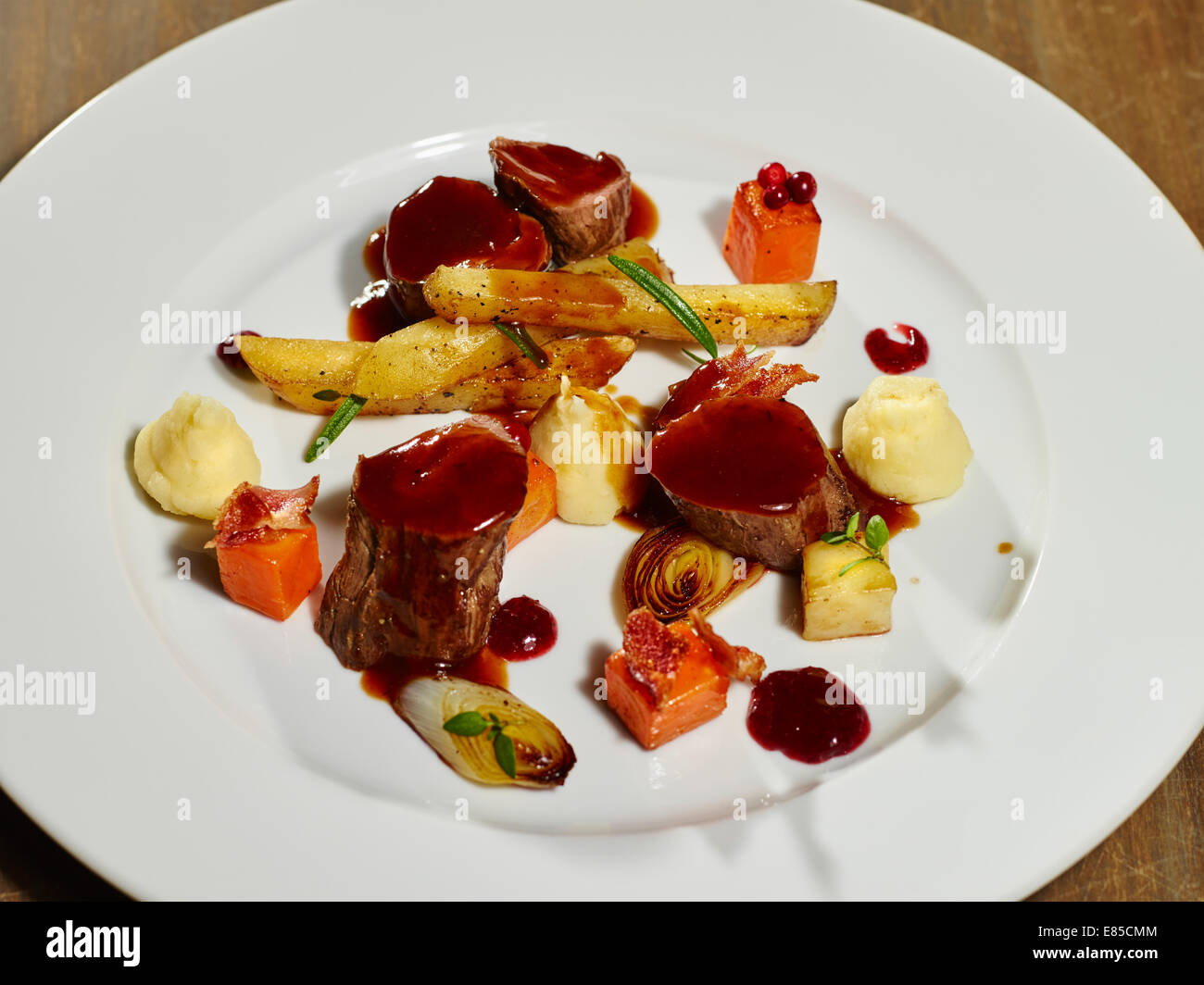 A gourmet meal, the fried reindeer file and the vegetables Stock Photo ...
