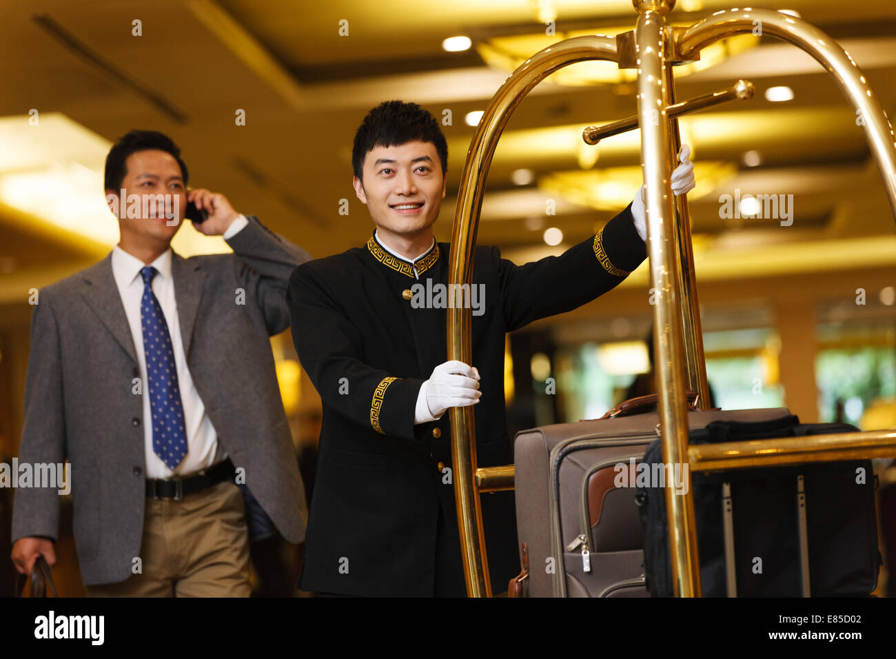 Portrait of hotel service staff Stock Photo - Alamy