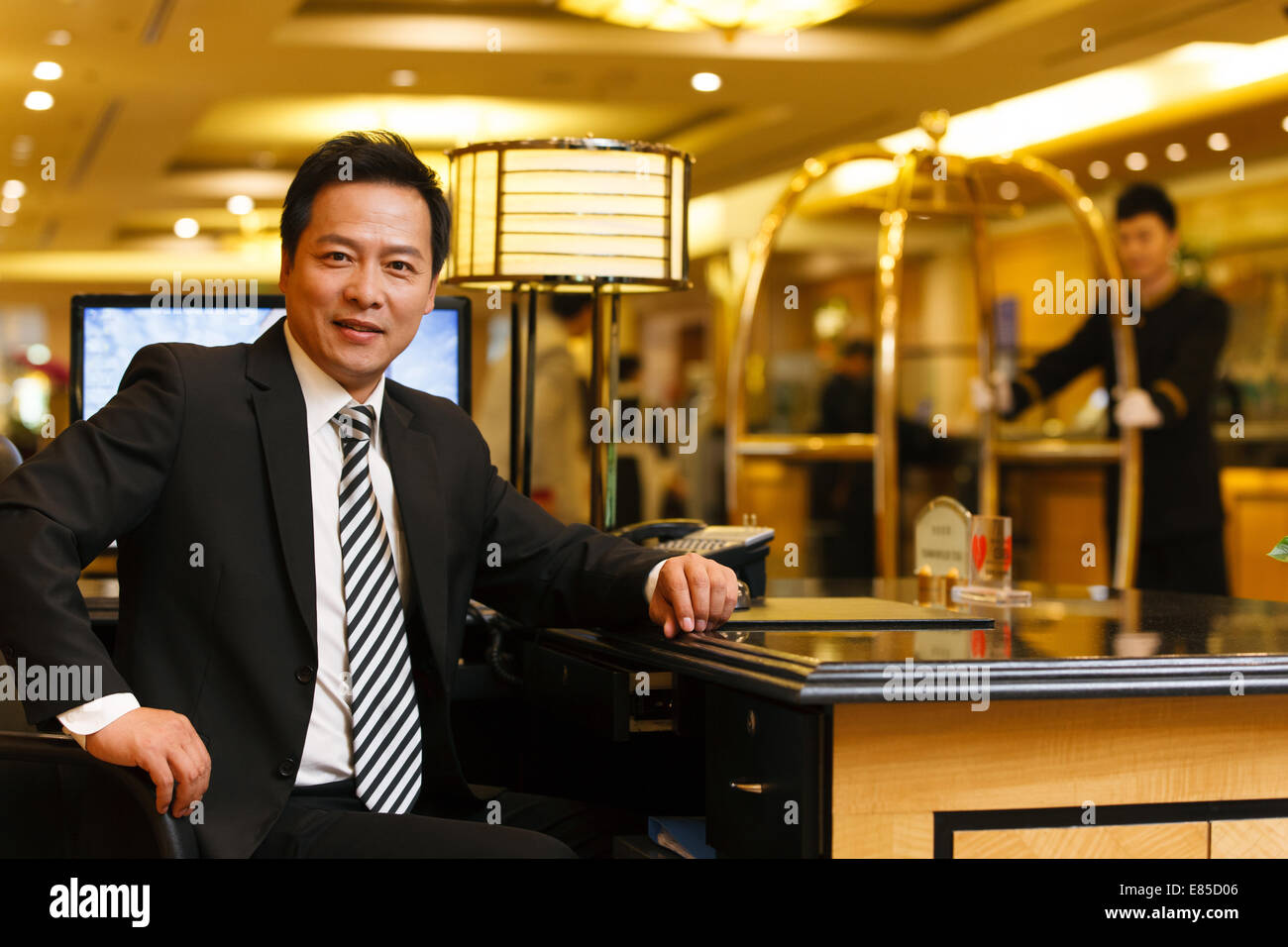 Portrait of hotel service staff Stock Photo - Alamy