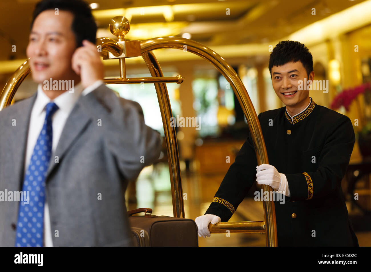 Portrait of hotel service staff Stock Photo - Alamy