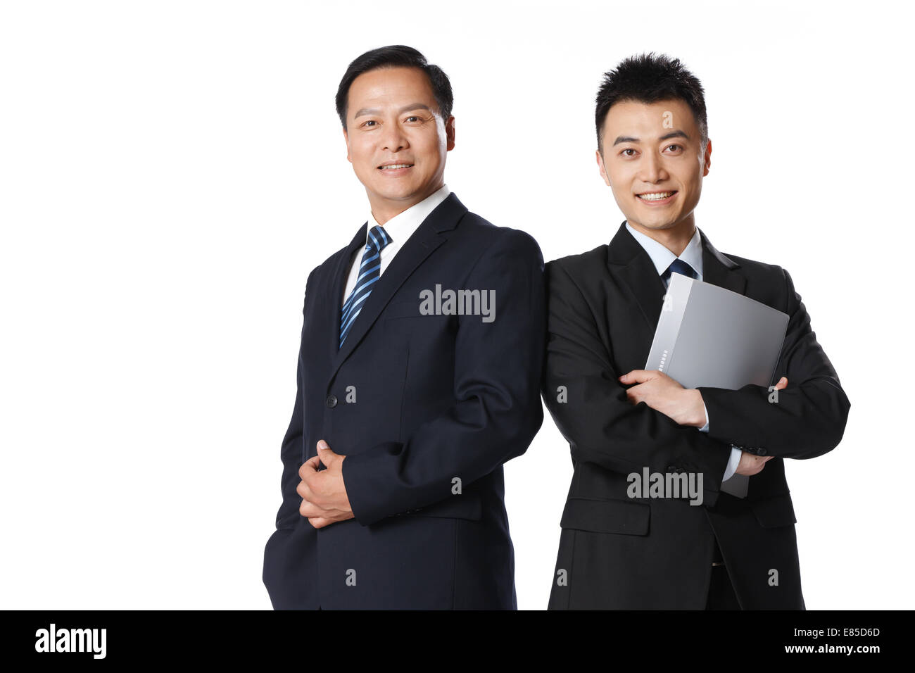 Two businessmen standing side by side hi-res stock photography and ...