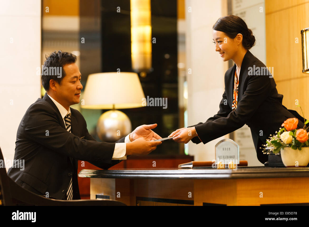 Hotel reception customer manager hi-res stock photography and images ...
