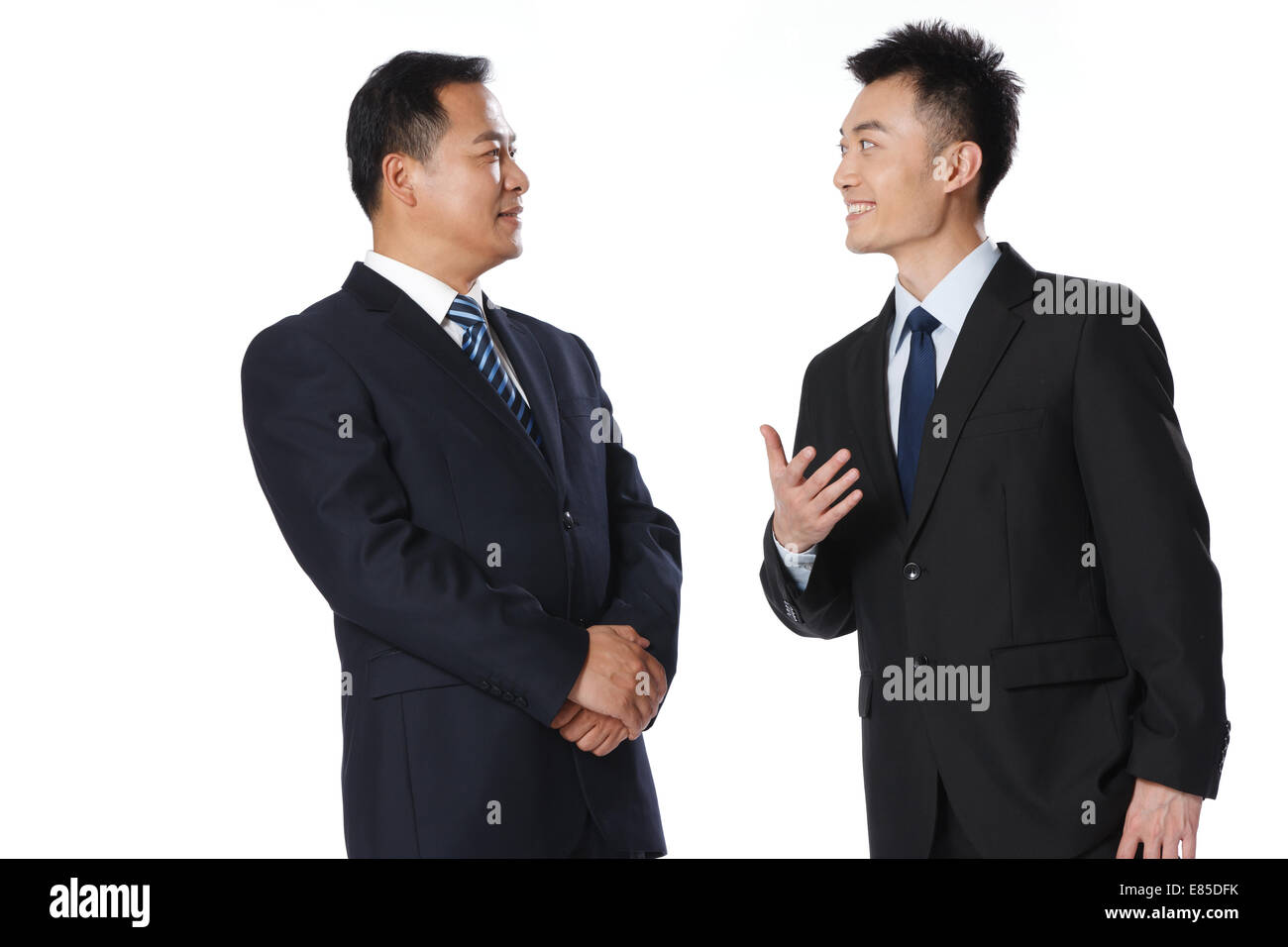 Two businessmen talking Stock Photo - Alamy