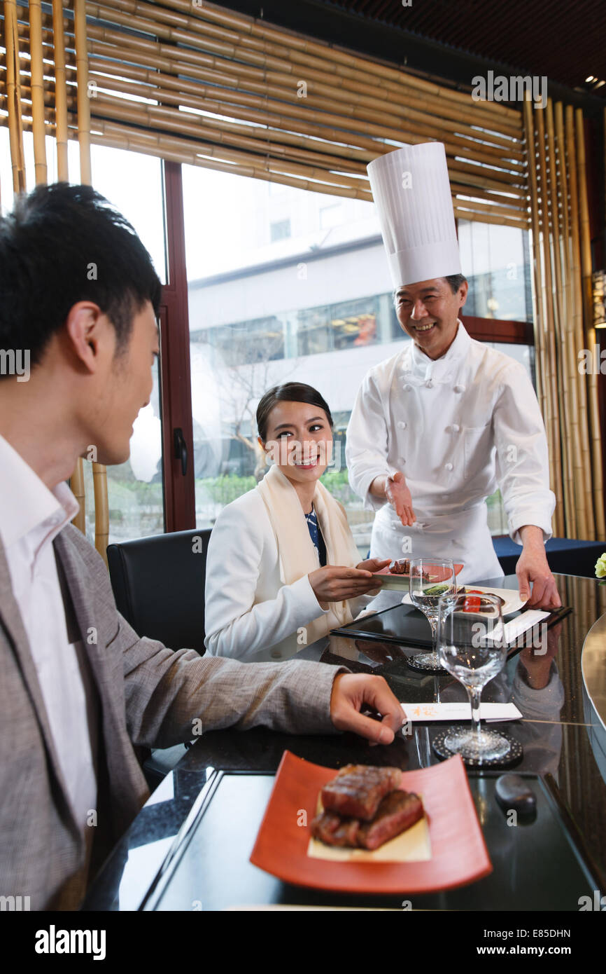 Chef with customer Stock Photo - Alamy