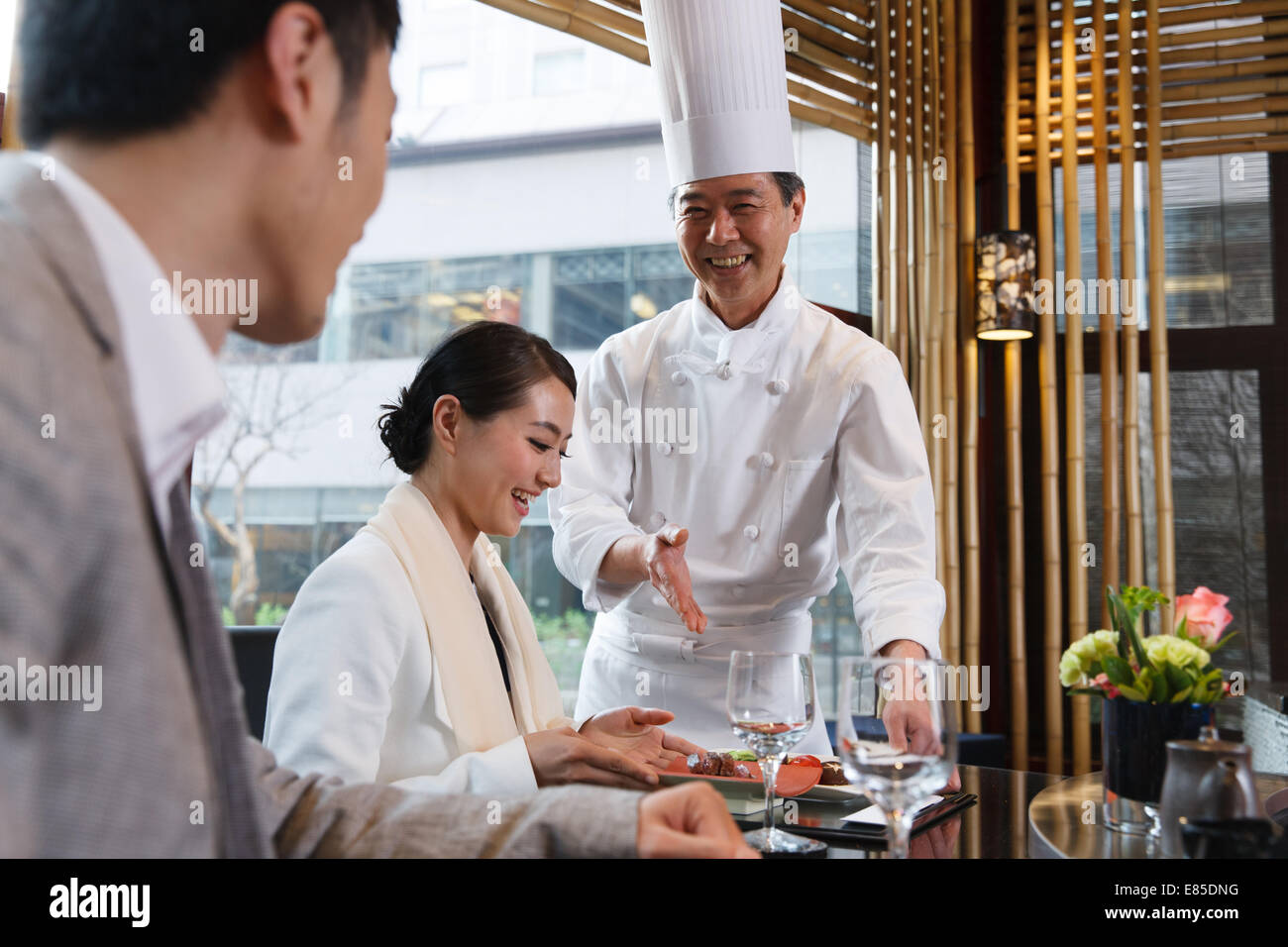 Chef with customer Stock Photo - Alamy