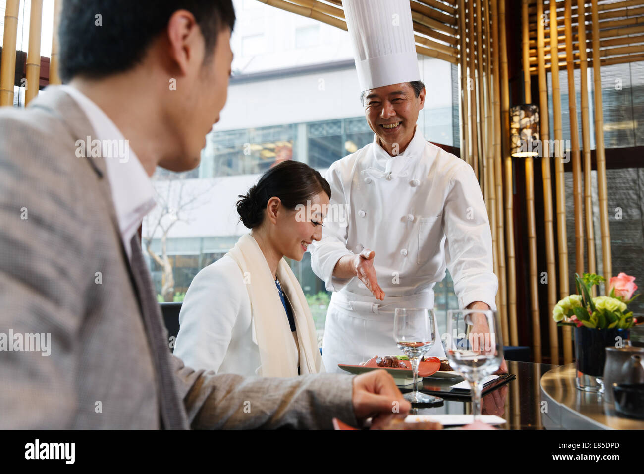Chef with customer Stock Photo - Alamy