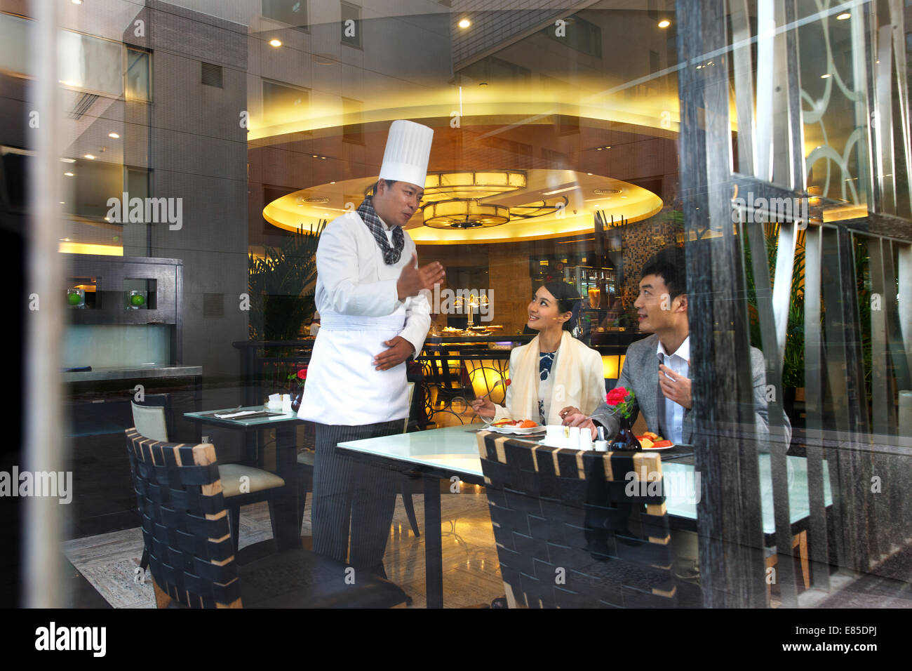 Chef with customer Stock Photo - Alamy