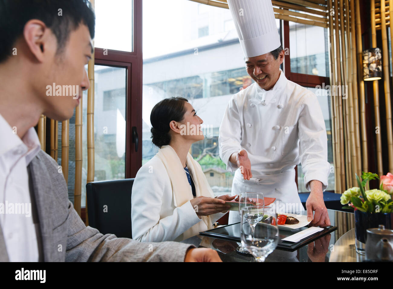 Chef with customer Stock Photo - Alamy