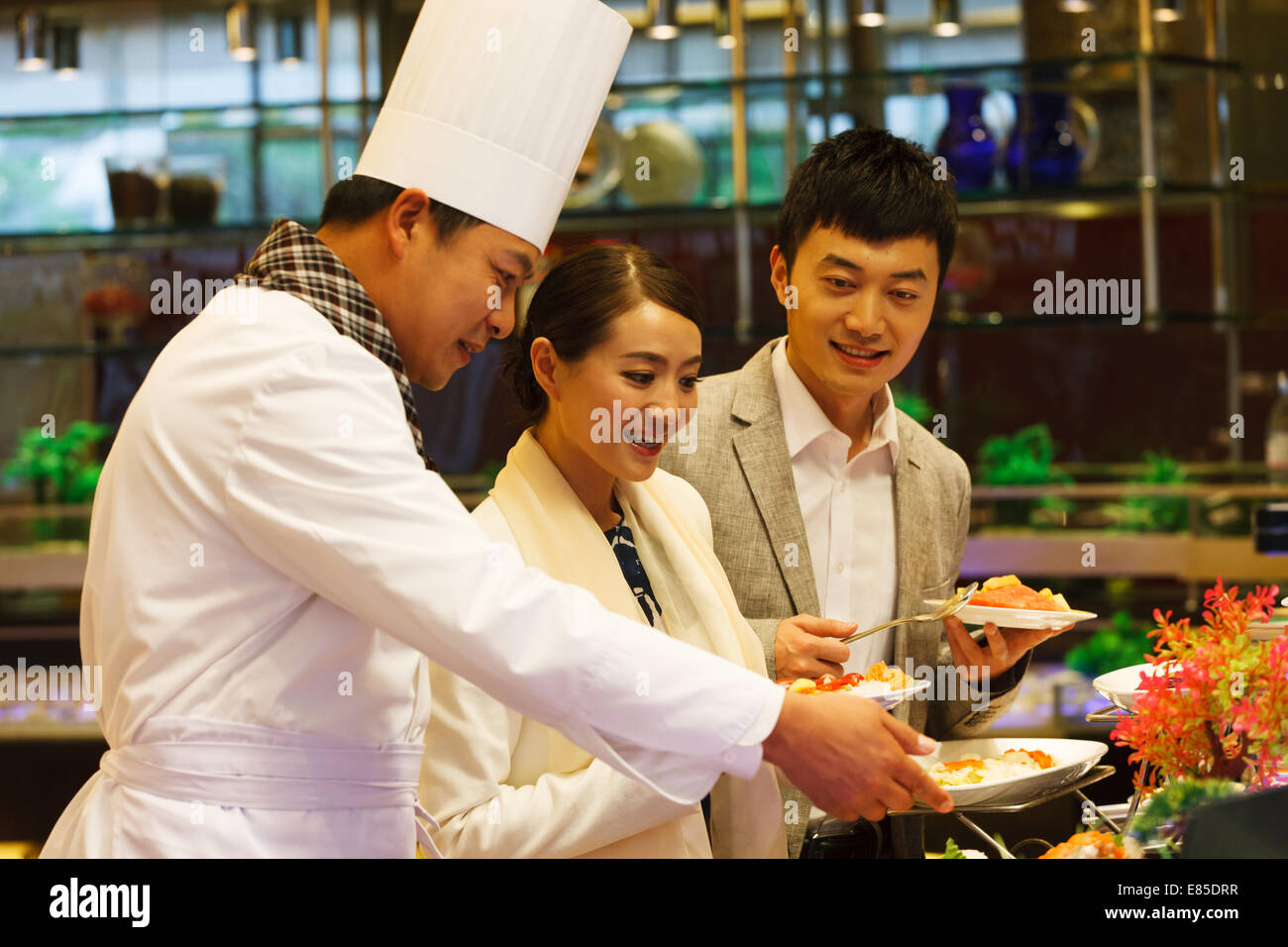 Chef with customer Stock Photo - Alamy