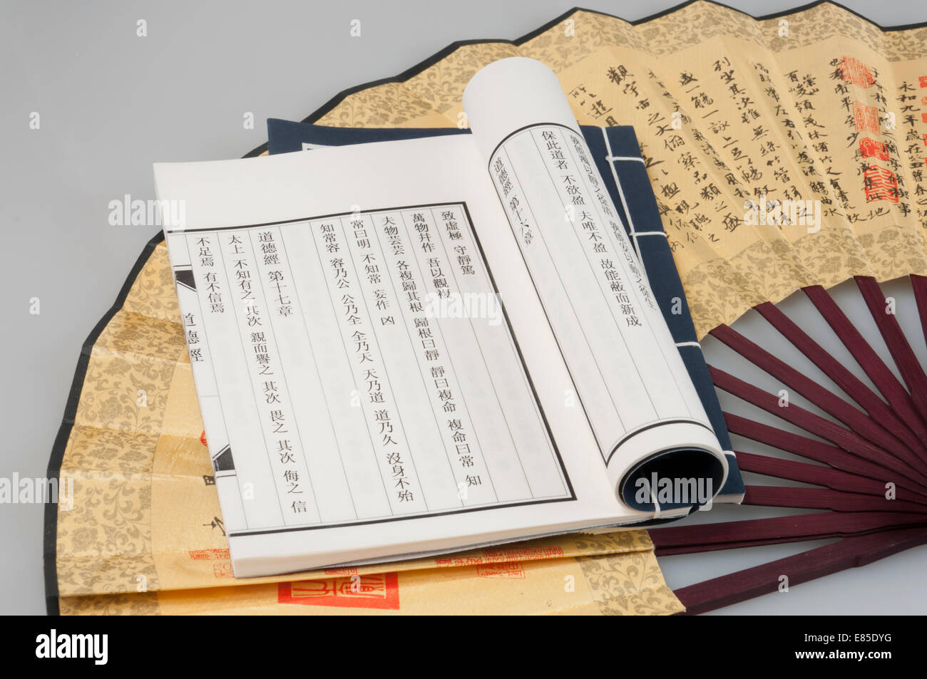 Close-up of fan and book Stock Photo - Alamy