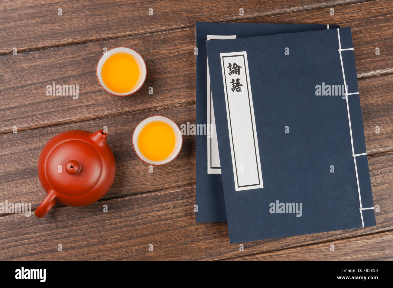 Tea set and book Stock Photo - Alamy