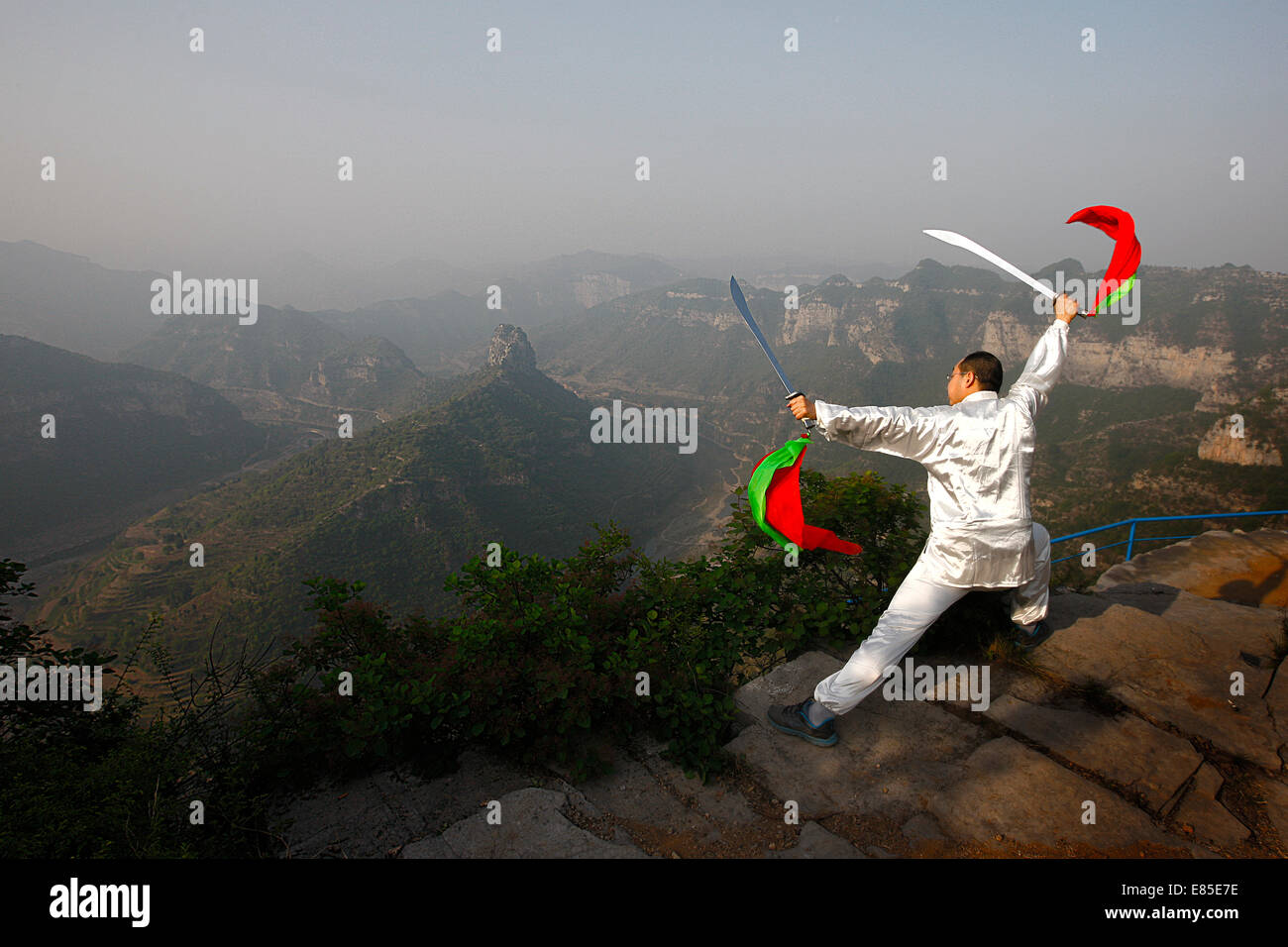 People doing exercise on hill Stock Photo - Alamy