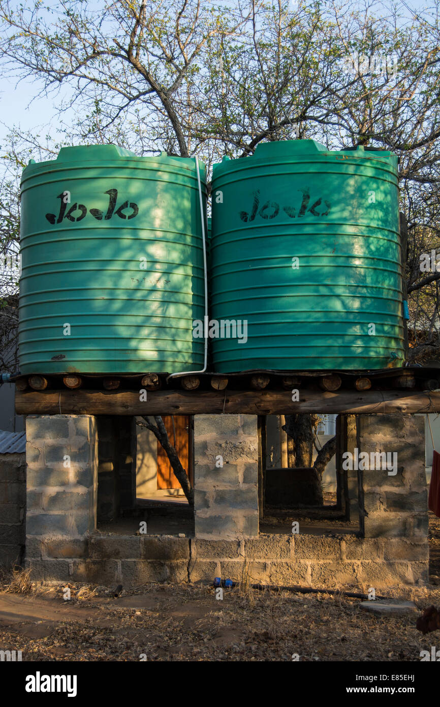 Two water tanks on a solid stand Stock Photo - Alamy